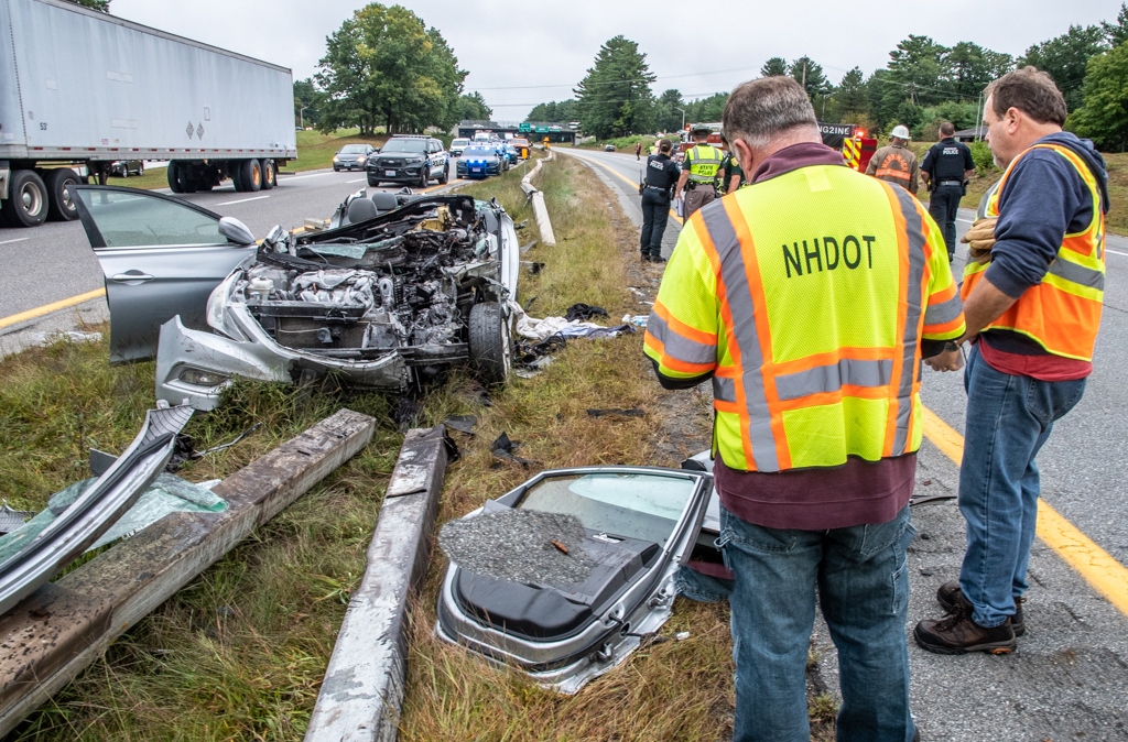 Section of Everett Turnpike guard rail impales vehicle, trapping driver ...